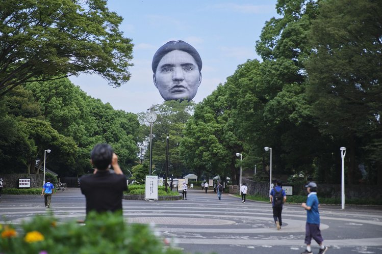 Massive Human Head Air Balloon Floats Over Tokyo in Surreal Display ...