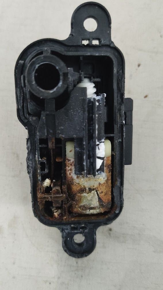Inside a failed fuel filler actuator. - AudiWorld Forums